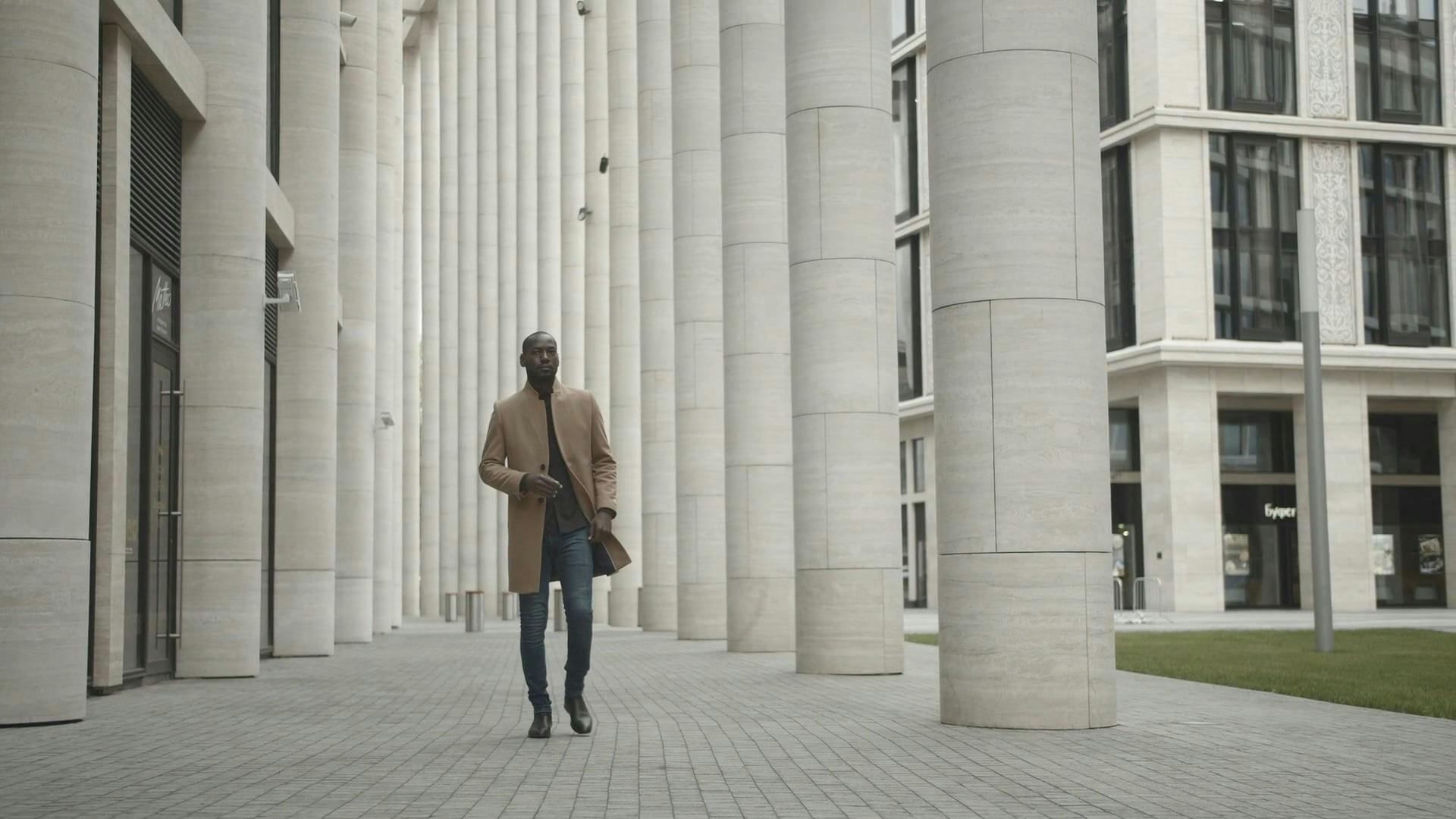 Man Walking Outside A Building - Stock Videos Now